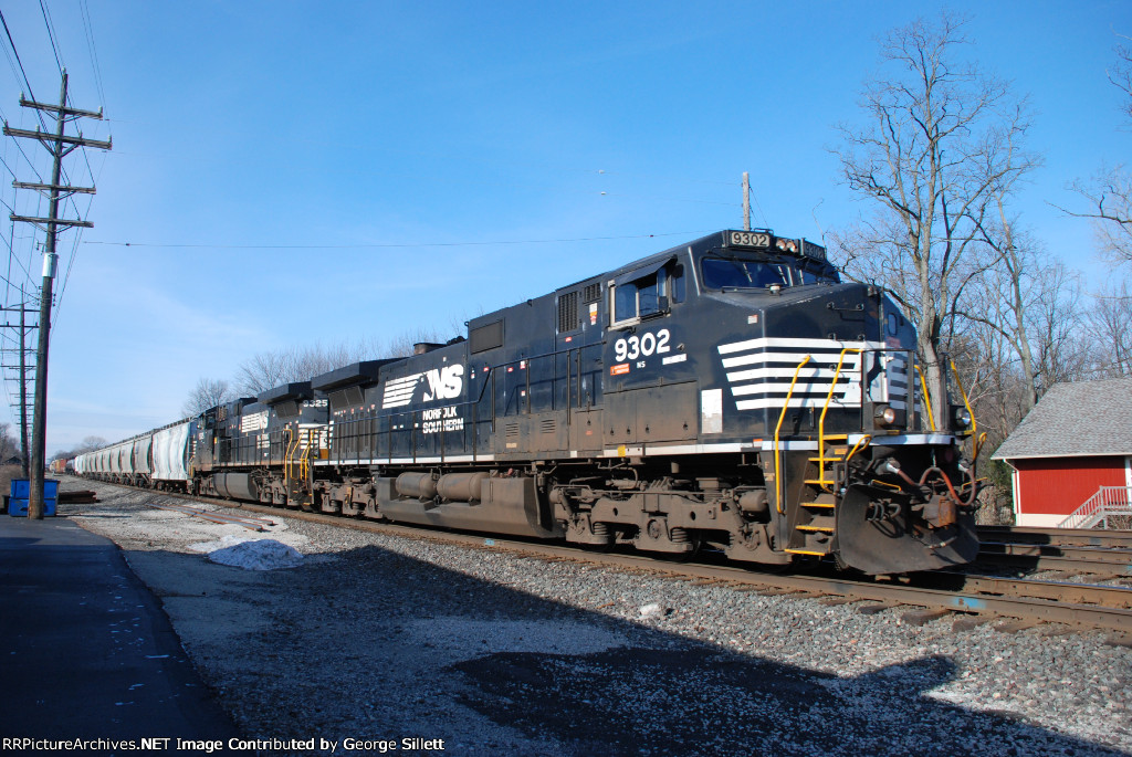 NS 9302 speeds east with a mixed freight.